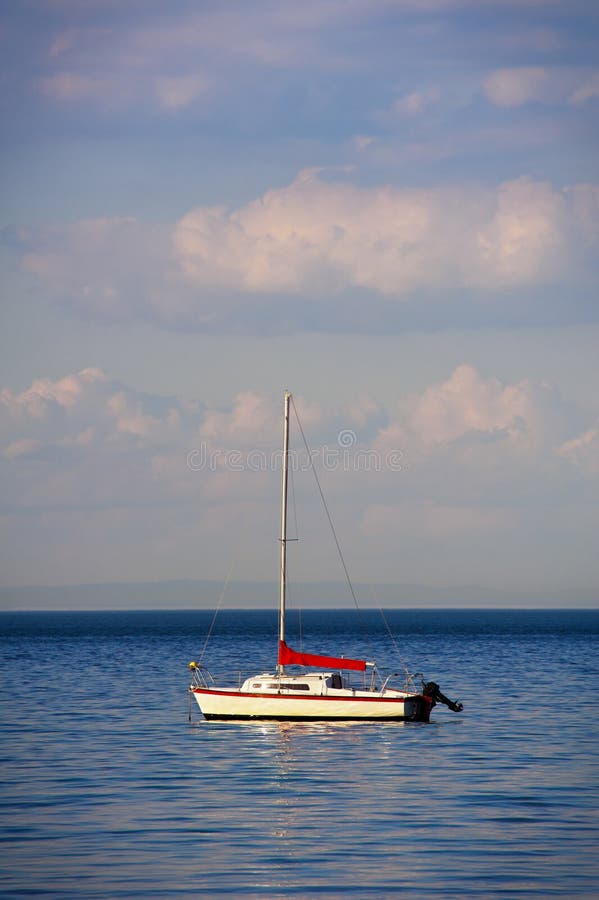 One Sailboat Moored at Sea stock photo. Image of color - 27616404