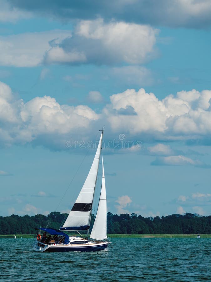 One Sailing Yacht Sailing at Full Sail on a Lake Stock Image - Image of ...