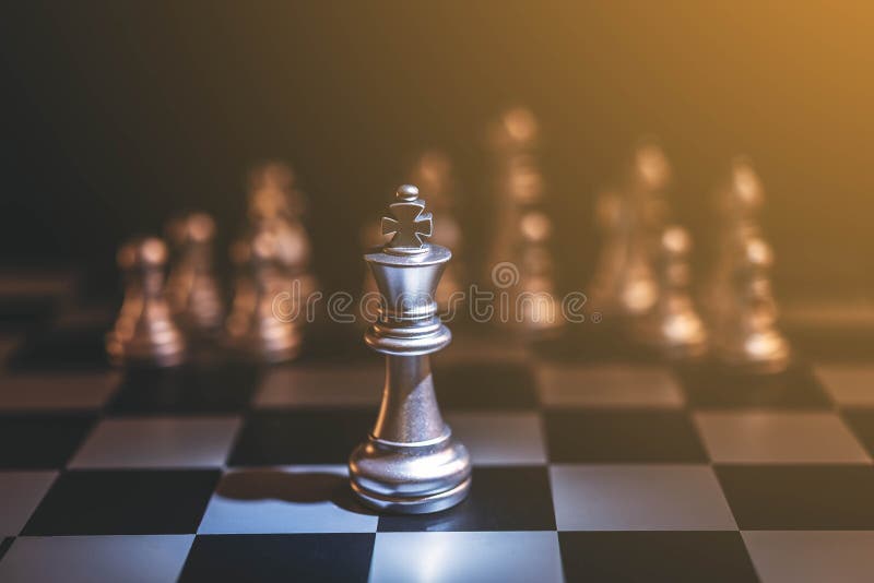 One Silver Chess Standing Against Full Set of Chess Pieces. Strategy ...