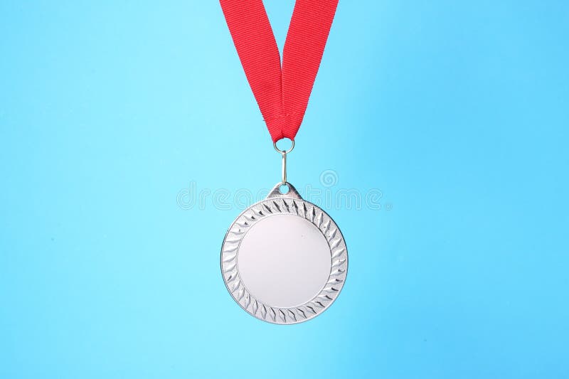 One Silver Medal with Ribbon on Light Blue Background Stock Photo ...