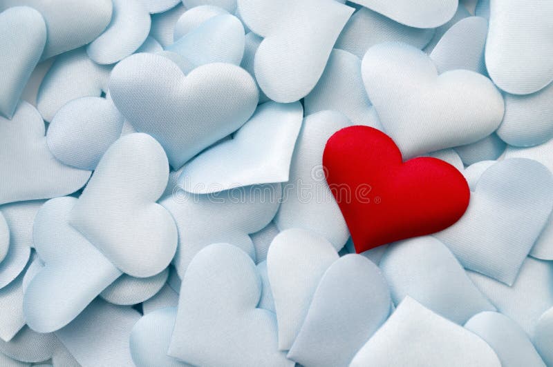 One Single Red Textile Heart on Multiple Pastel Blue Hearts with Copy ...
