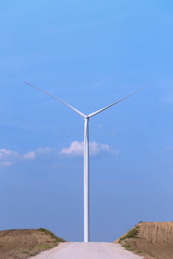 One Single Windmill Turbine in Front of Road with Blue Sky in ...