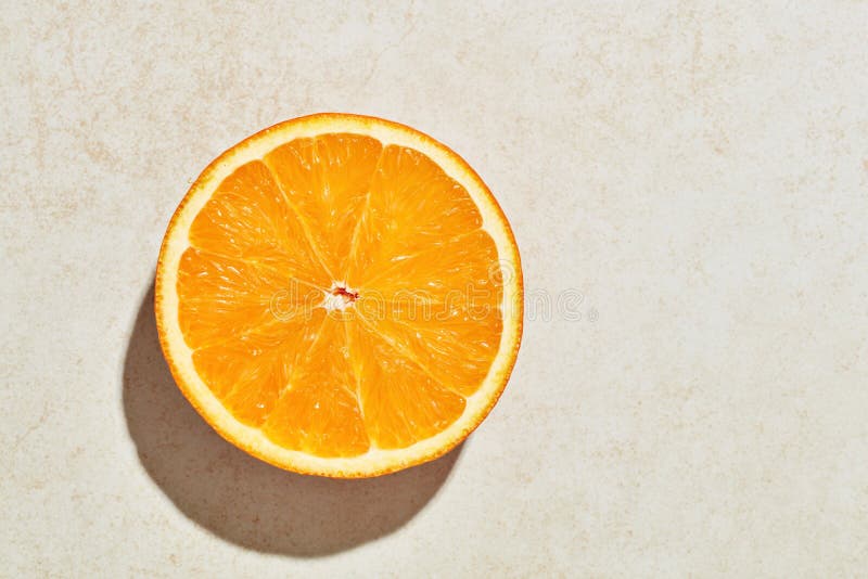 One Slice of Orange Under Harsh Sunlight with Copy Space Stock Image ...