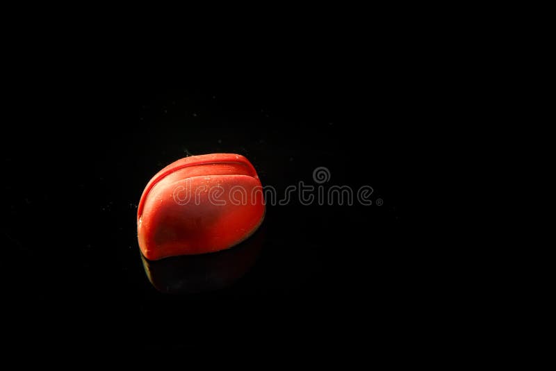 One Small Red Oval-shaped Chocolate Candy with Decoration Stock Image ...