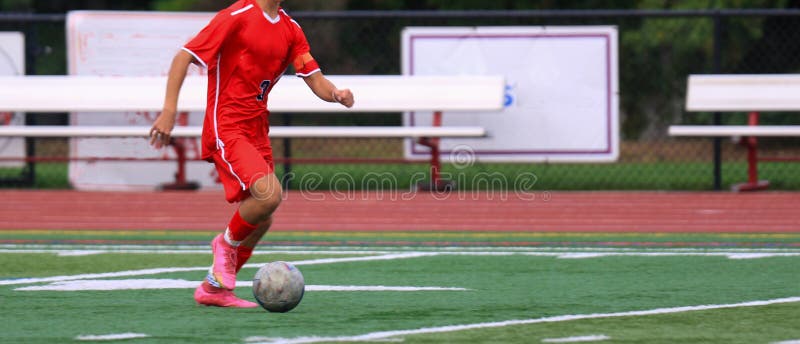 One Soccer Player Dribbling the Ball Down the Field Stock Image - Image ...