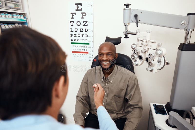 One Step Away from Better Eyesight. Shot of a Young Man Having an Eye ...