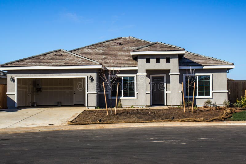 One Story New Construction House Stock Photo - Image of peaks, blue ...