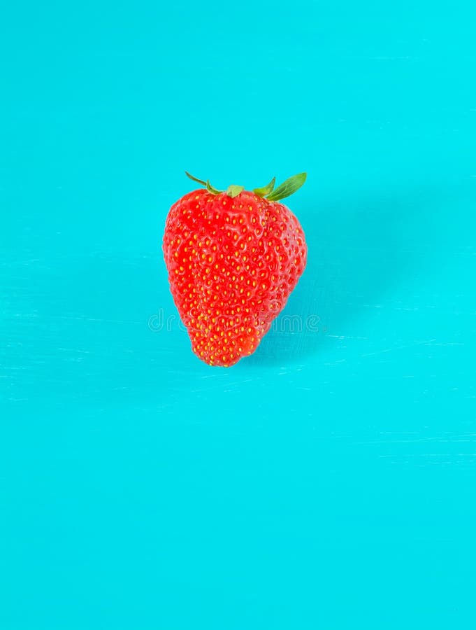 One Strawberry Berry on a Turquoise Background Stock Image - Image of ...