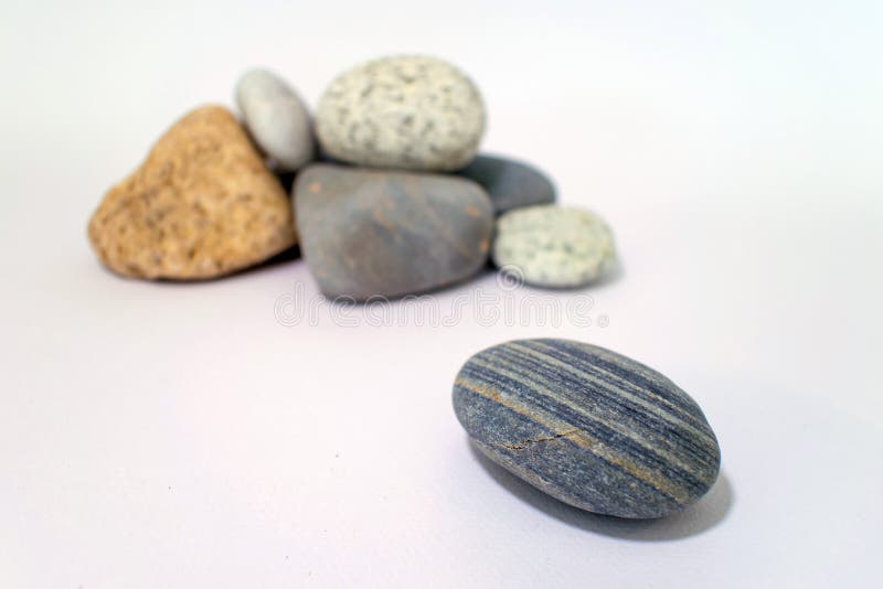 One Smooth Rock in Front of a Pile of Rocks Stock Photo - Image of ...