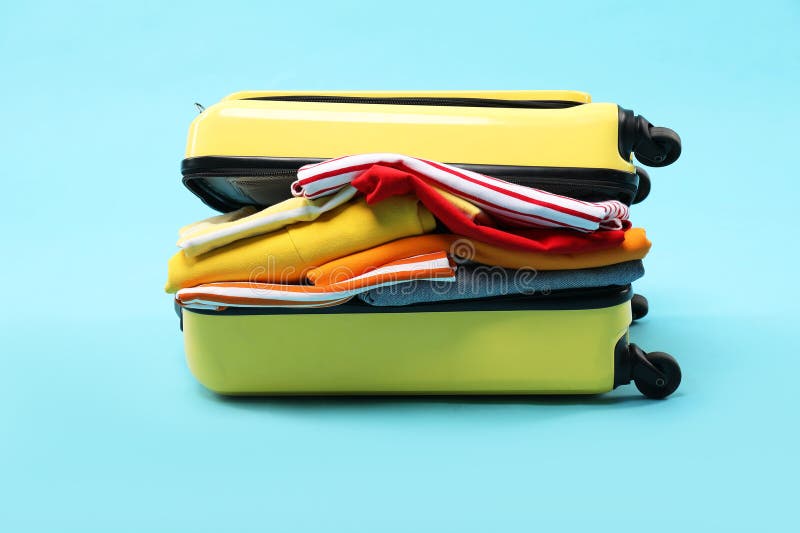 One Suitcase Clothes Light Blue Background Stock Photos - Free ...
