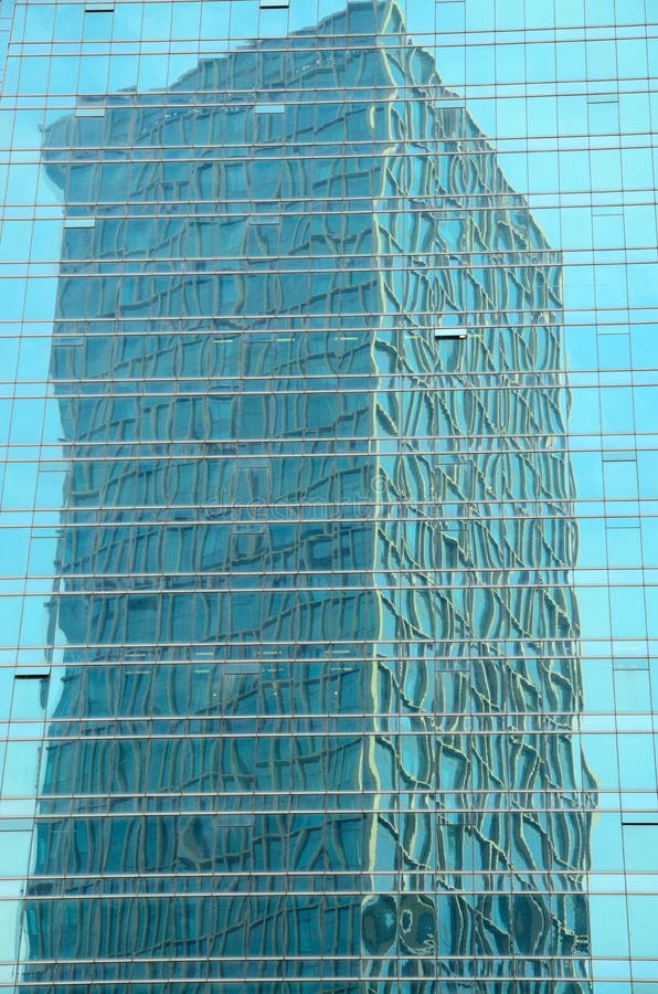 One Tower Mirrored in Another Building Stock Image - Image of blocks ...