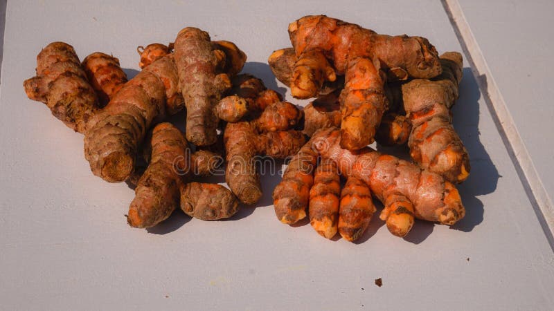 One Turmeric Segment on a Wooden Board. Stock Image - Image of segment ...
