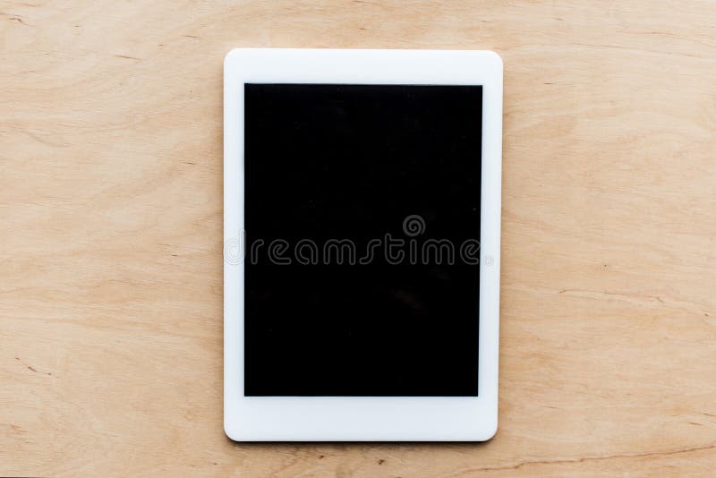 One Turned Off Tablet on Wooden Table Stock Photo - Image of simple ...