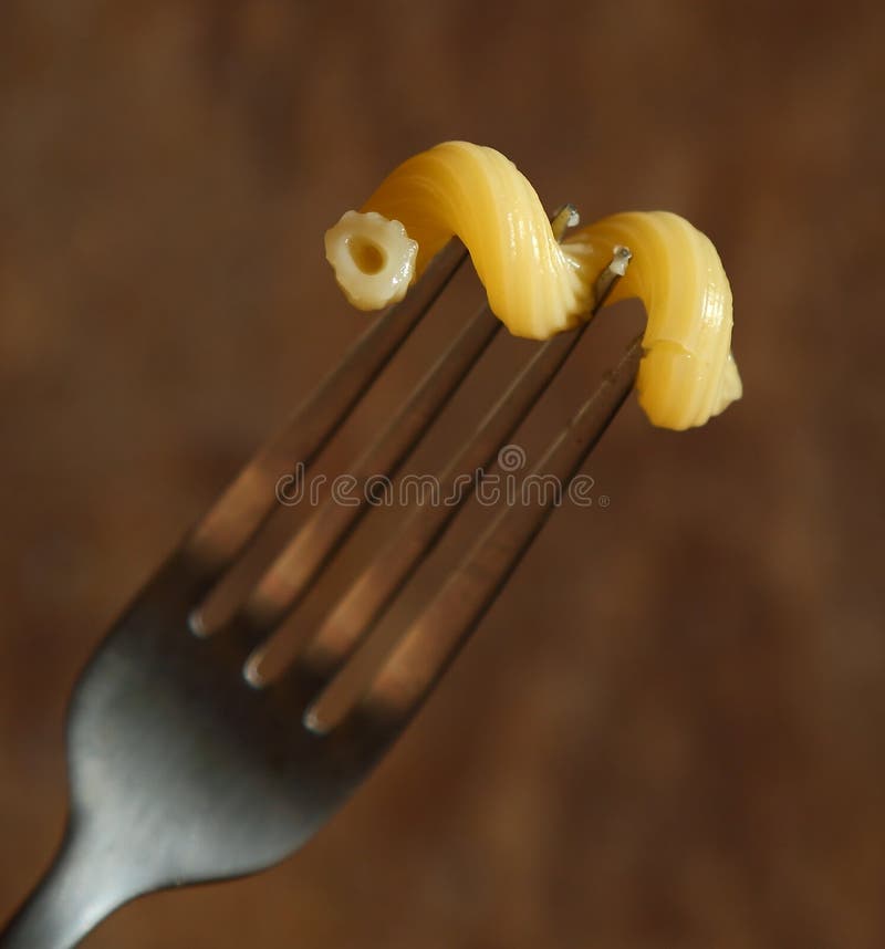 One Twisted Strand of Spaghetti on a Metal Fork Stock Image - Image of ...