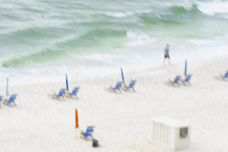One Unidentifiable Figure Walking on a White Sandy Beach with Beach ...