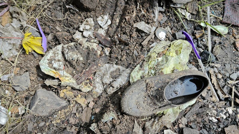 One Unwanted Rubber Shoe at the Decomposed Dumpster Ground. Stock Image ...