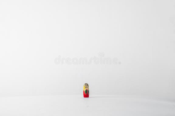 One Very Small Nesting Doll in the Center on a White Background Stock ...
