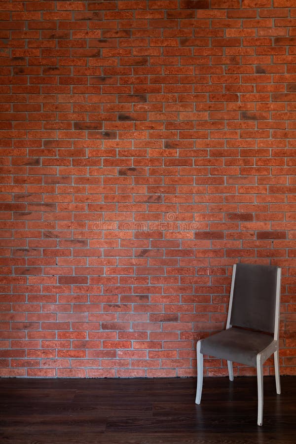 One Vintage Chair Against an Old Brick Wall in the Interior Stock Photo ...