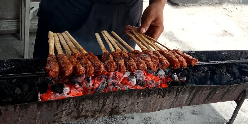 One Was Seen Grilling Fish Satay in a Bright and Catchy Color Stock ...