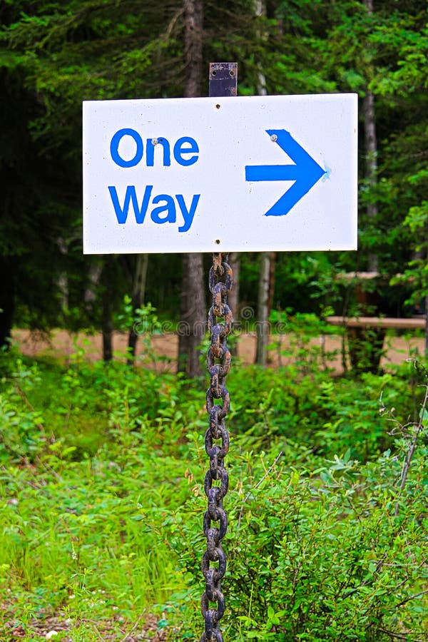 A One Way Sign with an Direction Arrow Stock Photo - Image of chain ...