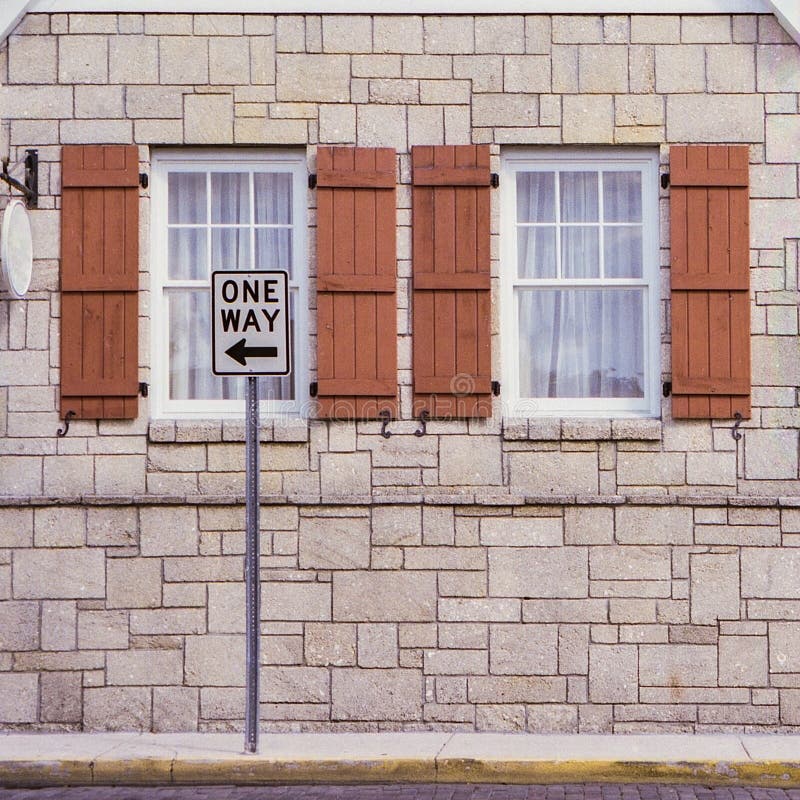 One Way Sign in Front of Windows Stock Photo - Image of limestone ...