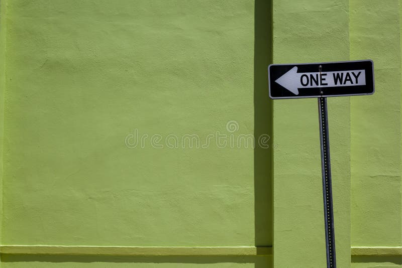 One Way Sign & Green Wall Stock Image - Image of leaning, outside: 25841087