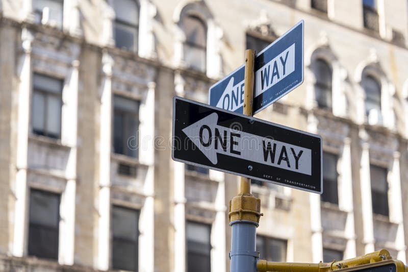 One Way Signs with a City Backdrop Stock Photo - Image of crossroad ...