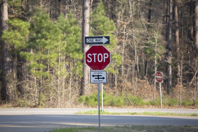 One Way, Stop, and Divided Highway Signs Editorial Photo - Image of ...
