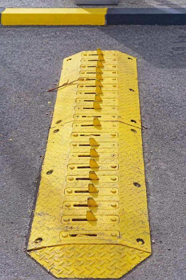 Spikes in a Parking Lot Enforcing Wrong Way. Stock Photo - Image of ...