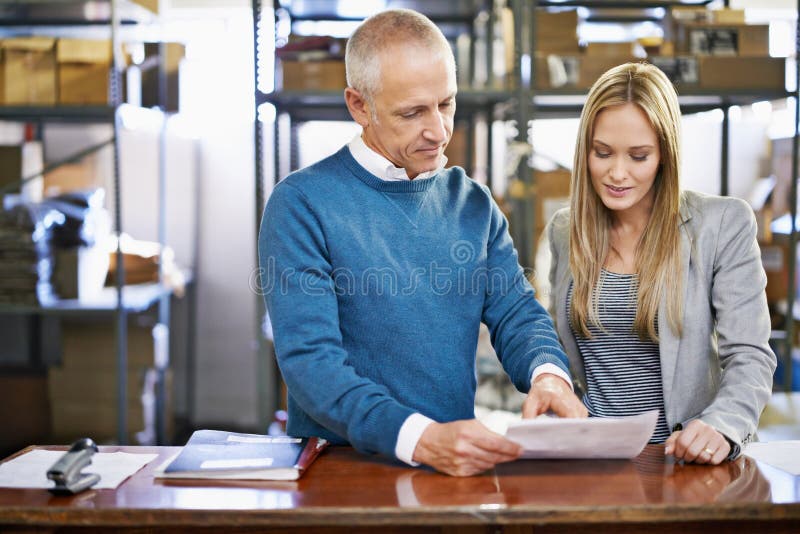 This is the One Were Looking for. a Two Managers Looking through ...