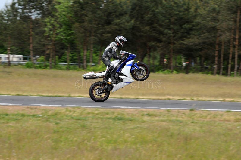 One wheel racing stock image. Image of motion, ride, brave - 5916945