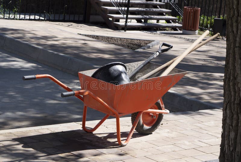 One-wheeled Construction Wheelbarrow with a Set of Construction Tools ...