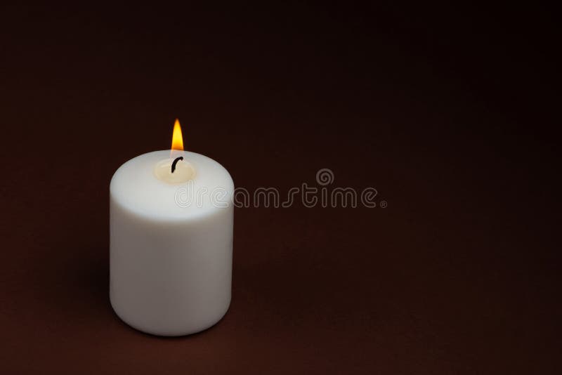 One WhiteÂ candleÂ flameÂ burningÂ onÂ dark BackgroundÂ withÂ copyÂ ...