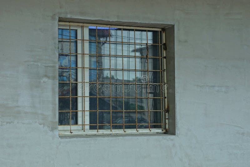 One White Square Window Behind an Iron Bars Stock Image - Image of ...