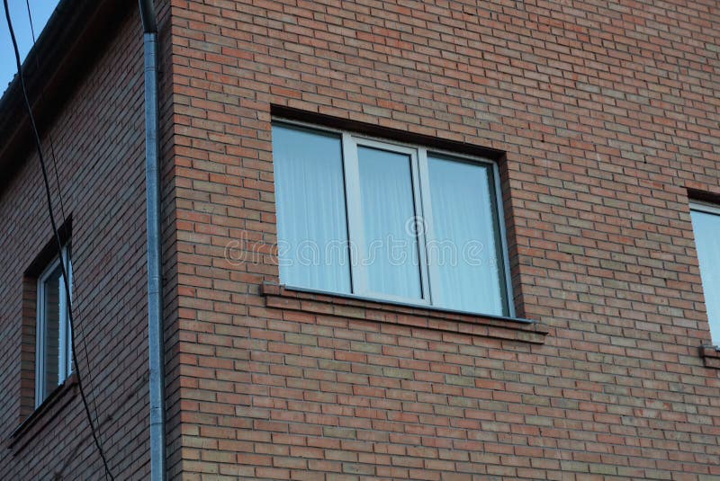 One White Square Window on a Brown Brick Wall Stock Photo - Image of ...