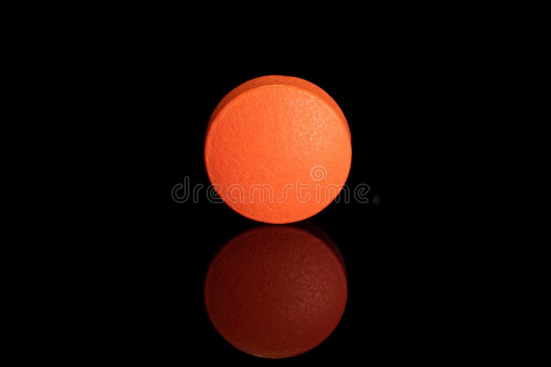 Orange Pharmacy Tablet Isolated on Black Glass Stock Image - Image of ...