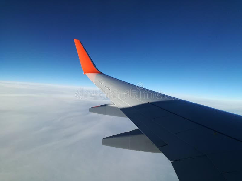 One Wing of the Aircraft in the Blue Sky Stock Photo - Image of ...