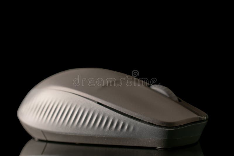 One Wireless Computer Mouse, Macro, Isolated on a Black Background ...