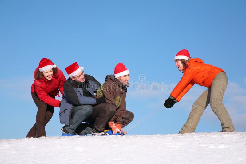 One Woman Pull Two Men on Sled Stock Image - Image of human, healthy ...