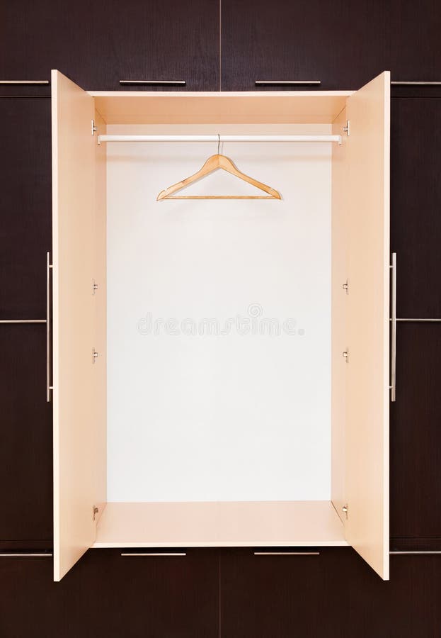 One Wooden Coat Hanger on Clothes Rail in the Closet. Empty Stock Image ...