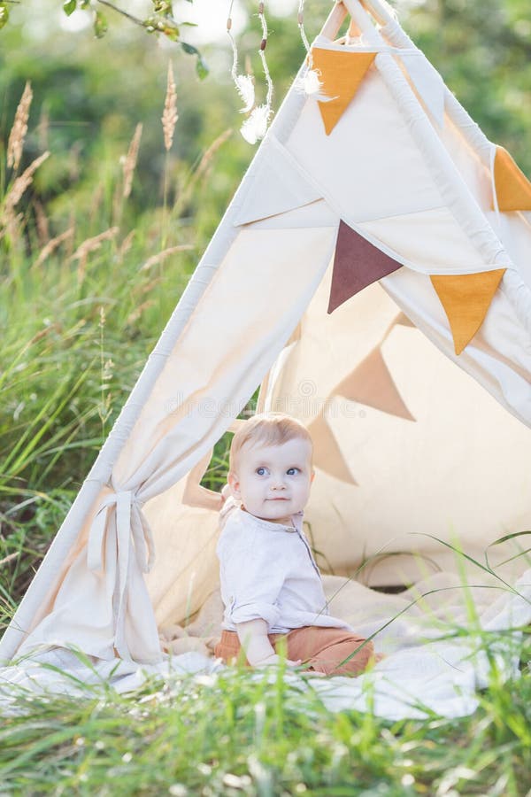 One Year Cute Boy in a Teepee Outdoors. Stock Photo - Image of flag ...