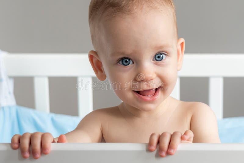 One Year Old Baby Standing in a Crib Smiling Stock Photo - Image of ...