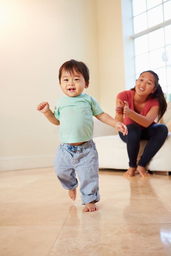 One Year Old Boy Taking First Steps Mother Stock Photos - Free ...
