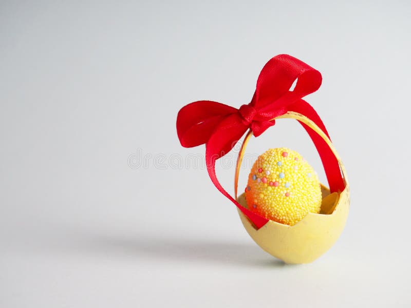 One Yellow Egg in a Shell, with a Bow, Easter Concept Stock Image ...