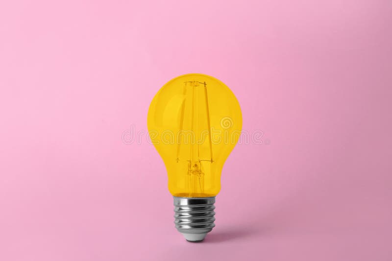 One Yellow Light Bulb on Pink Background Stock Image - Image of lamp ...