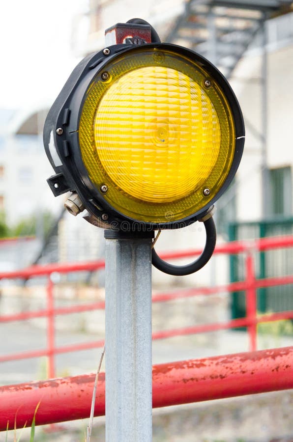 One Yellow Signal Light with Red Barrier Gate Stock Photo - Image of ...