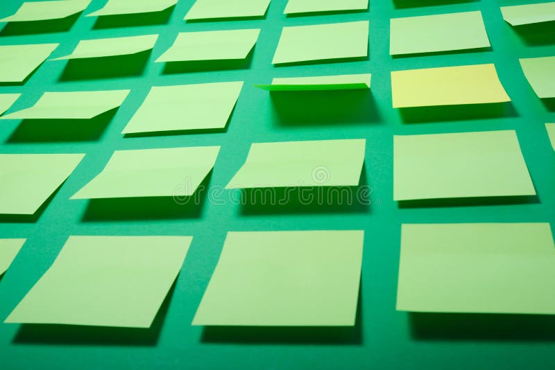 Many Light Green Sticky Notes on a Green Background, Selective Focus ...