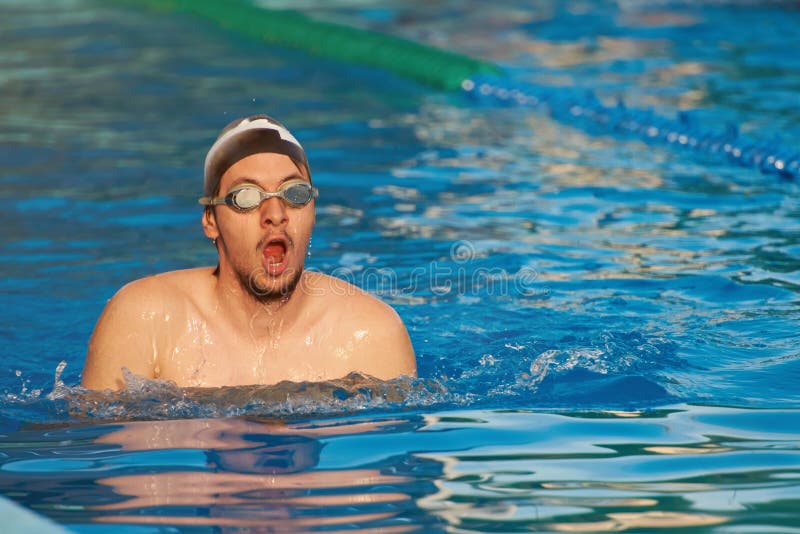 One young man swim in pool stock image. Image of indoor - 92507949