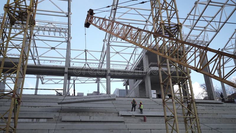 The Ongoing Construction Progress of a Modern Structure Using Cranes ...