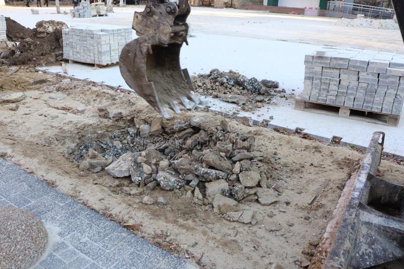A Bustling Construction Site Featuring Large Heavy Machinery and ...